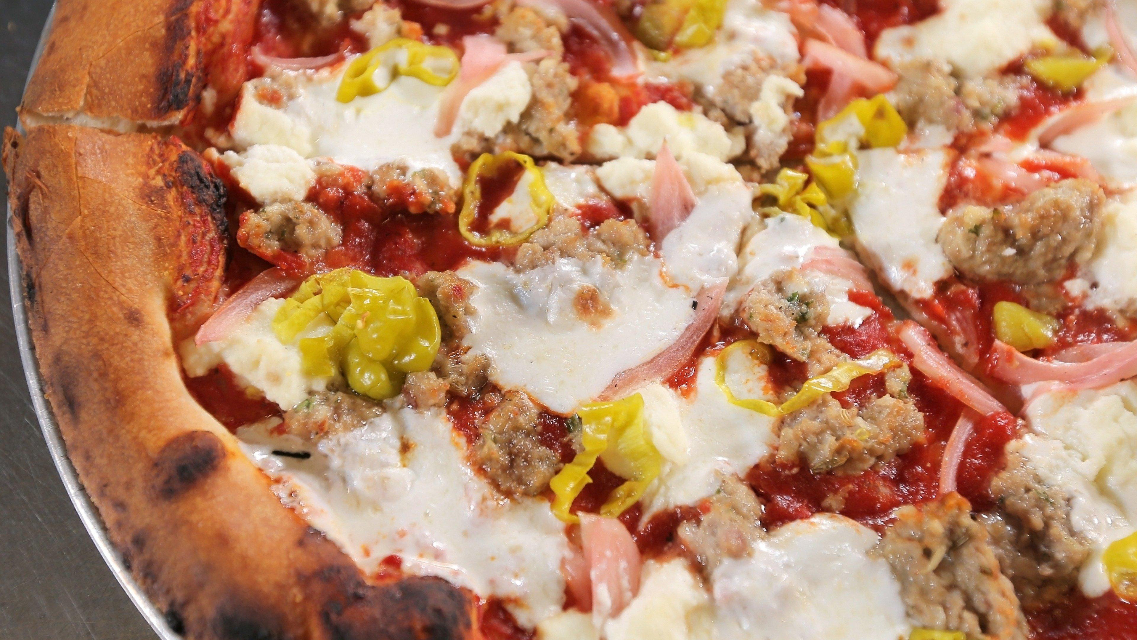 Diners, Drive-Ins and Dives: Pizza, Pork and Peru